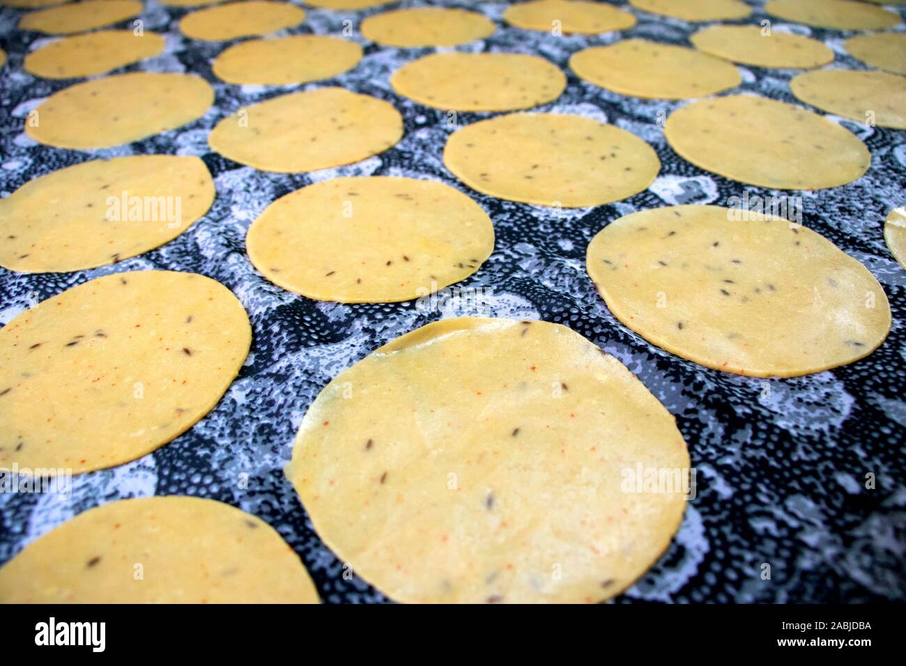 Khichiya papdi papad Rice flour crackers or Papadom drying in the sun ...