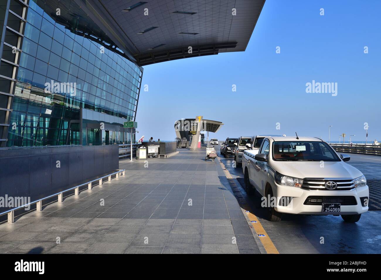 Doha, Qatar - Nov 17. 2019. Cars in front of the entrance to Hamad ...