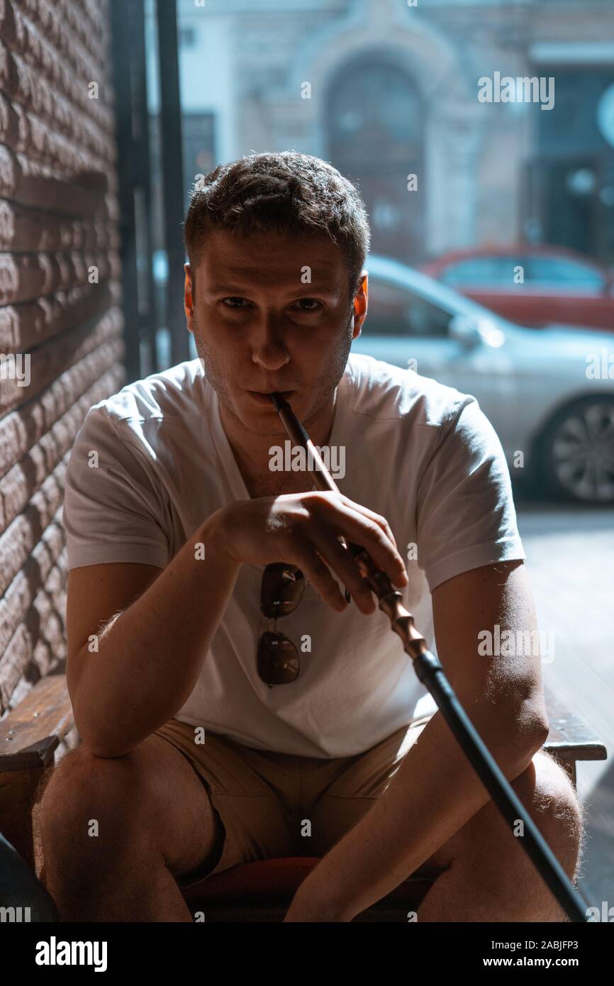 Silhouette of hookah maker blowing smoke in the dark Stock Photo - Alamy