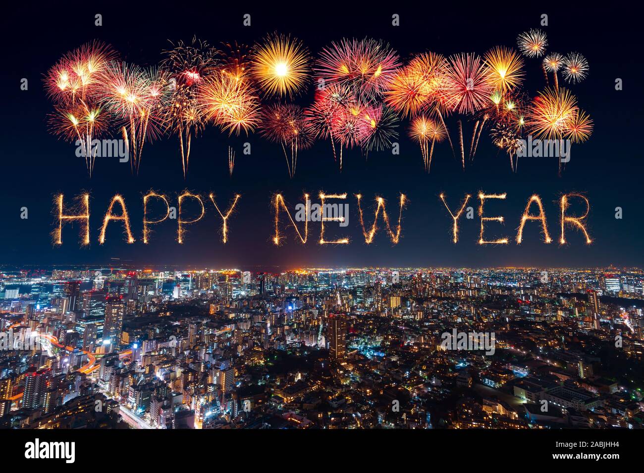 Happy New Year fireworks celebrating over Tokyo cityscape at night ...