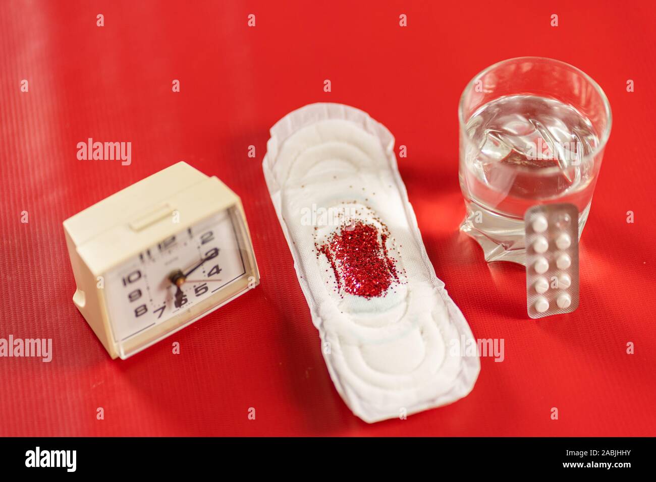 close up of woman hygiene protection on red background Stock Photo - Alamy