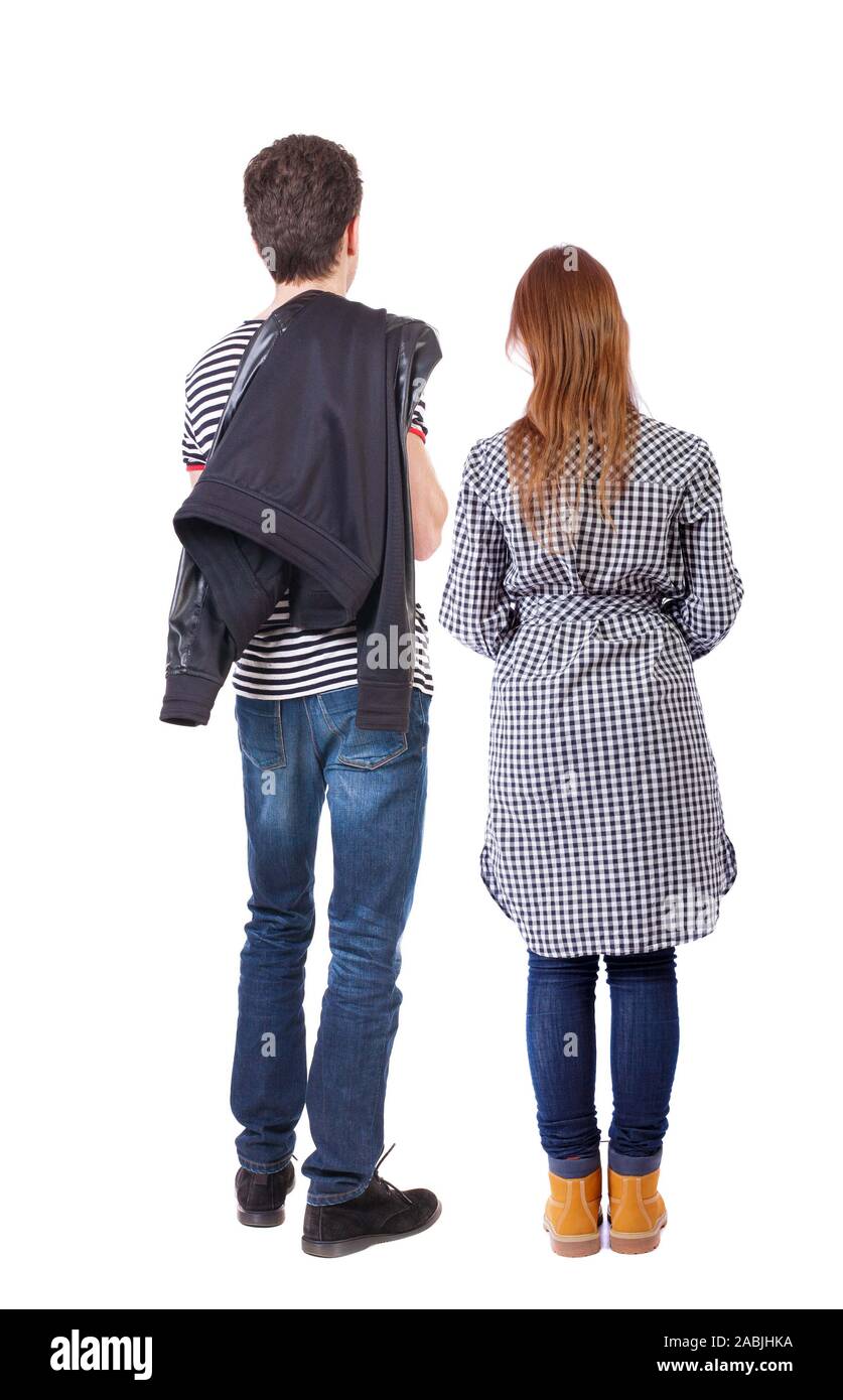 Back view of couple. beautiful friendly girl and guy together. Rear ...