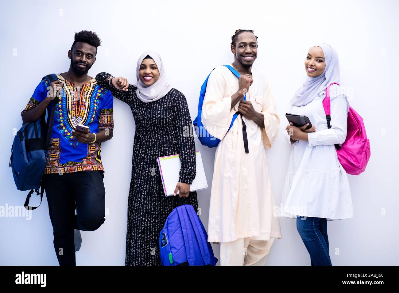 group portrait of happy african students standing together against ...