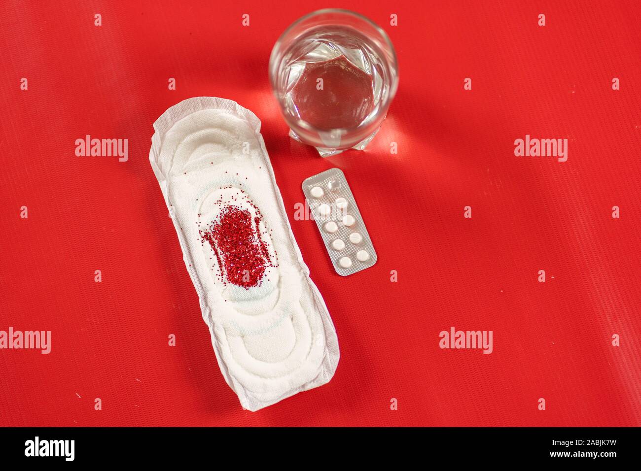 close up of woman hygiene protection on red background Stock Photo - Alamy