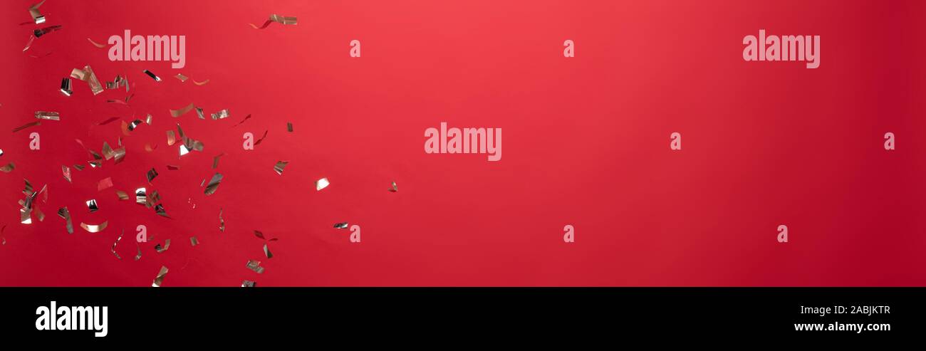view of golden christmas confetti isolated on red with copy space Stock ...