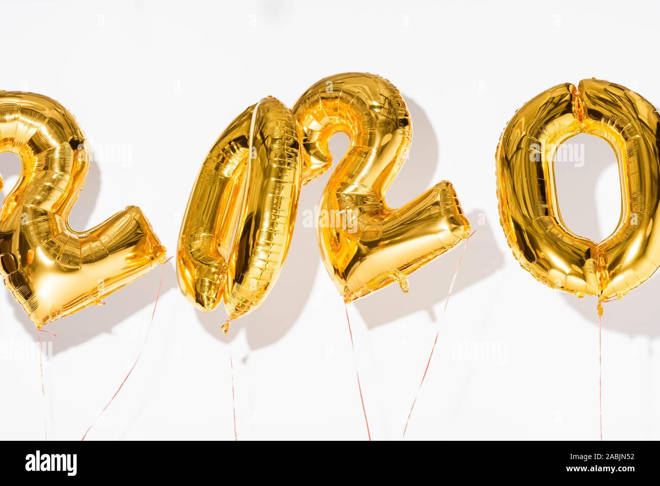 shiny balloons with 2020 numbers on white Stock Photo - Alamy