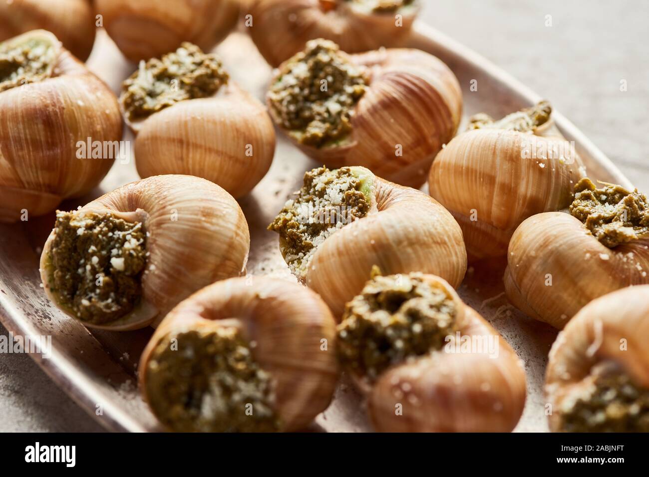 close up view of delicious cooked escargots on plate Stock Photo - Alamy