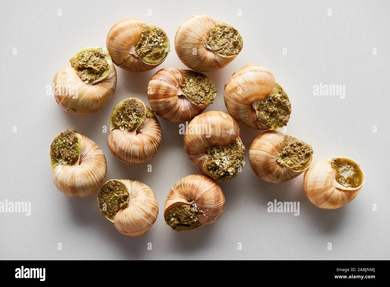 top view of delicious cooked escargots on white background Stock Photo ...