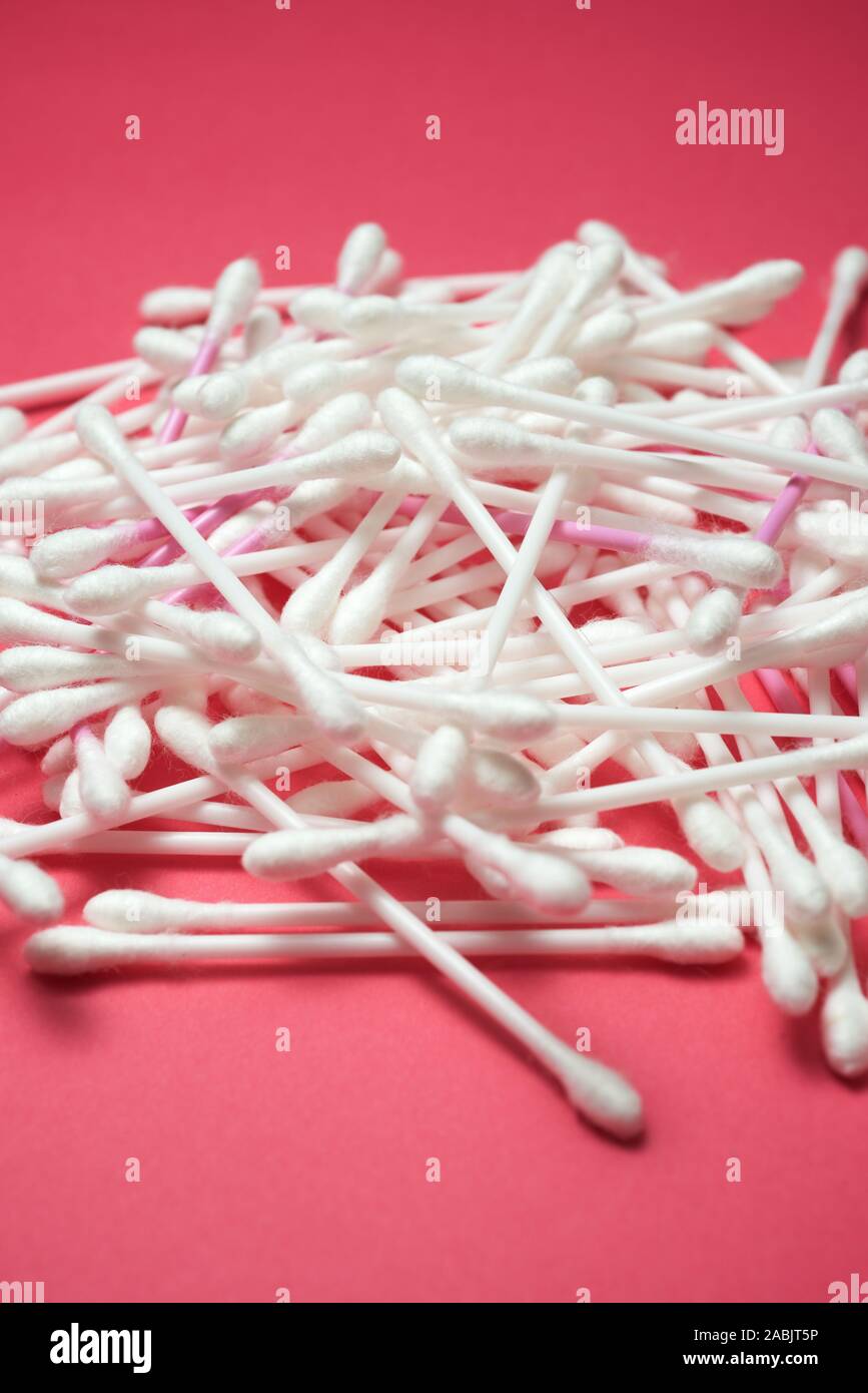 Ear swabs on a pink table Stock Photo - Alamy
