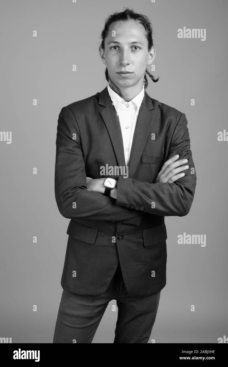 Young businessman with dreadlocks wearing suit in black and white Stock ...