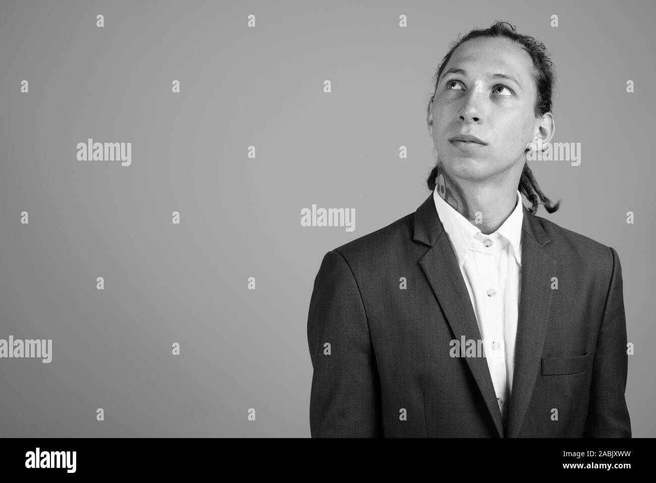Young businessman with dreadlocks wearing suit in black and white Stock ...