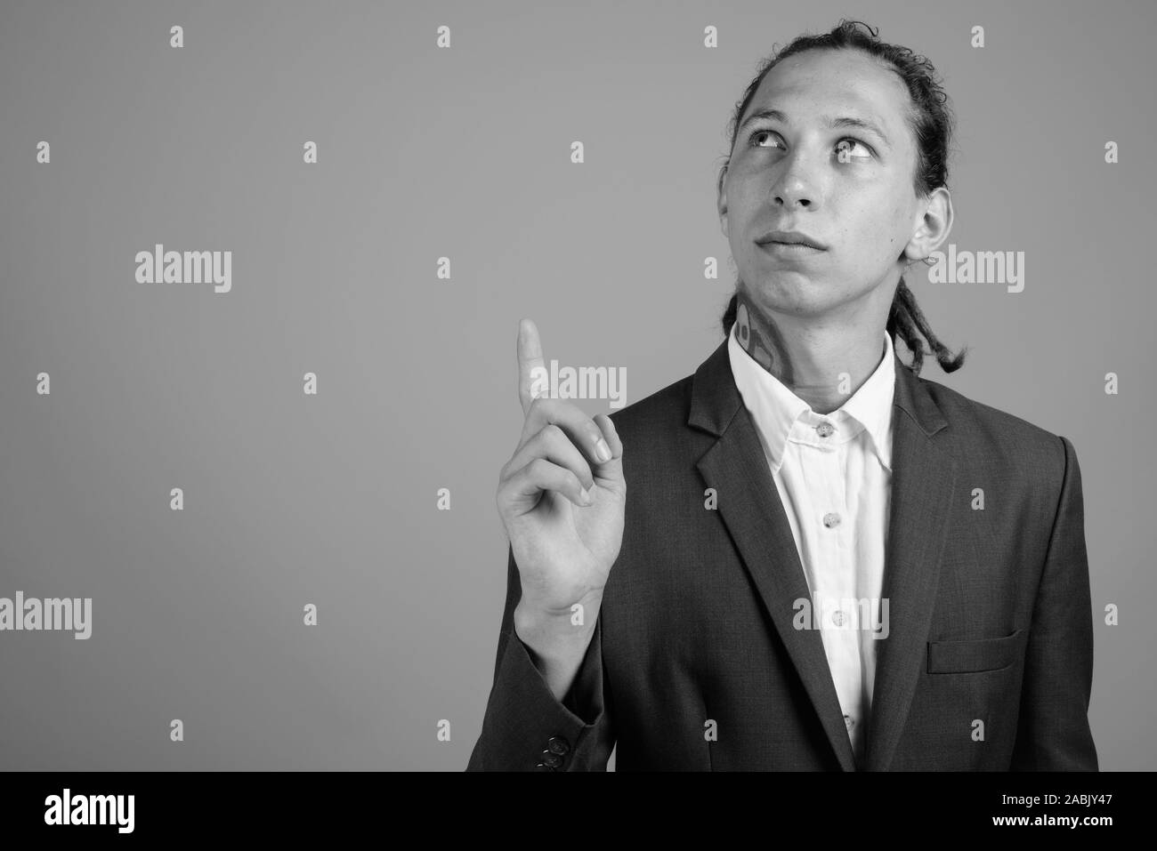 Young businessman with dreadlocks wearing suit in black and white Stock ...