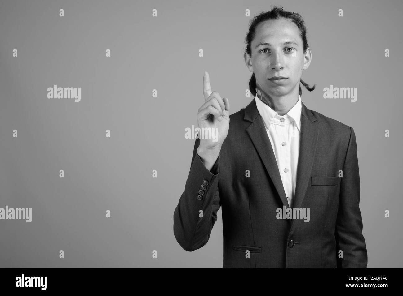 Young businessman with dreadlocks wearing suit in black and white Stock ...