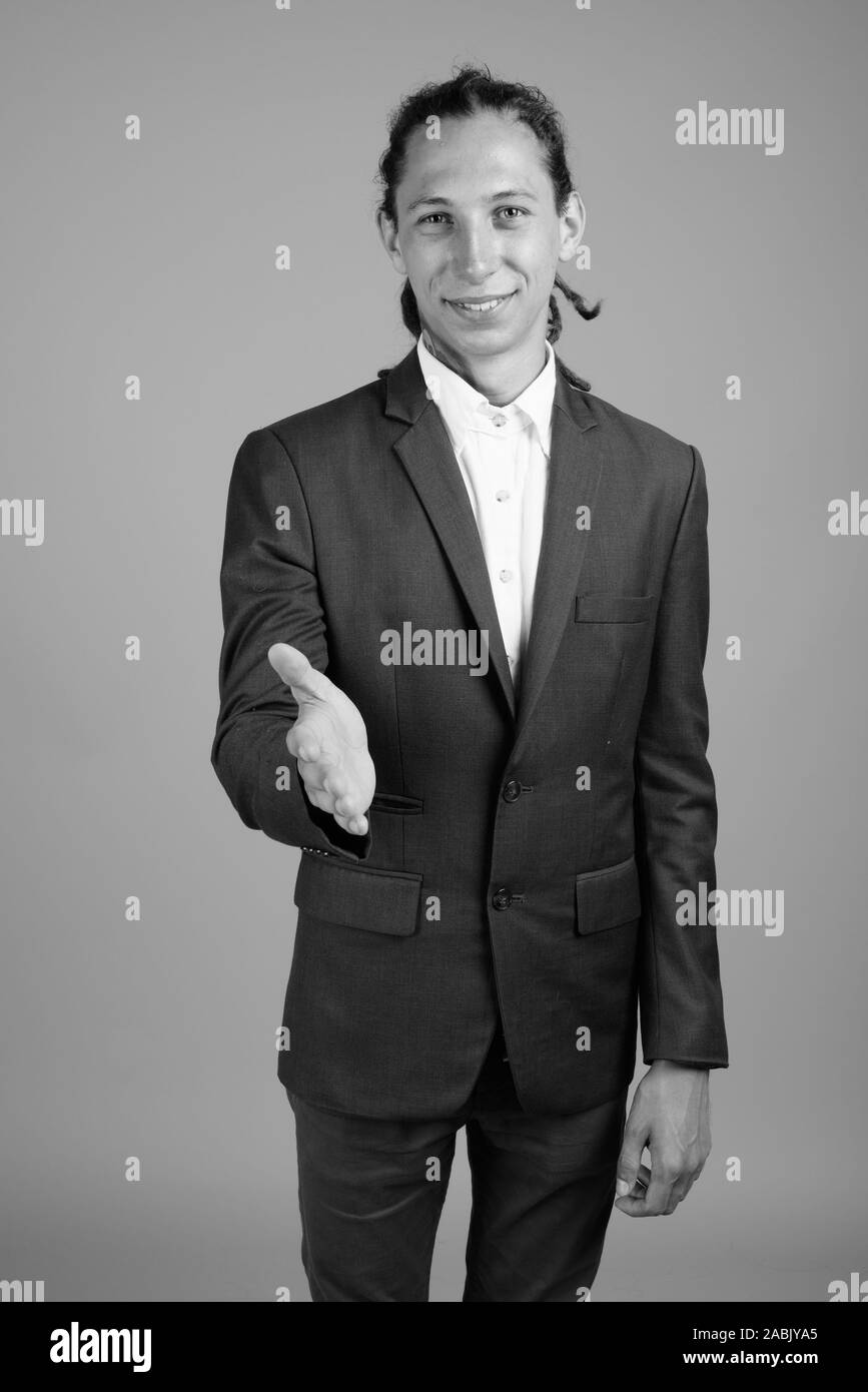 Young businessman with dreadlocks wearing suit in black and white Stock ...