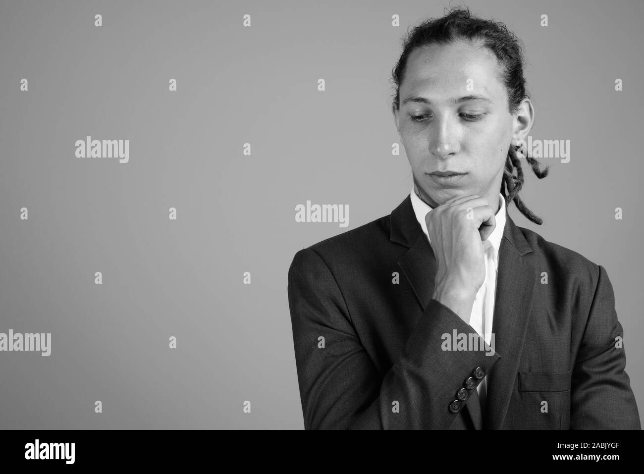 Young businessman with dreadlocks wearing suit in black and white Stock ...