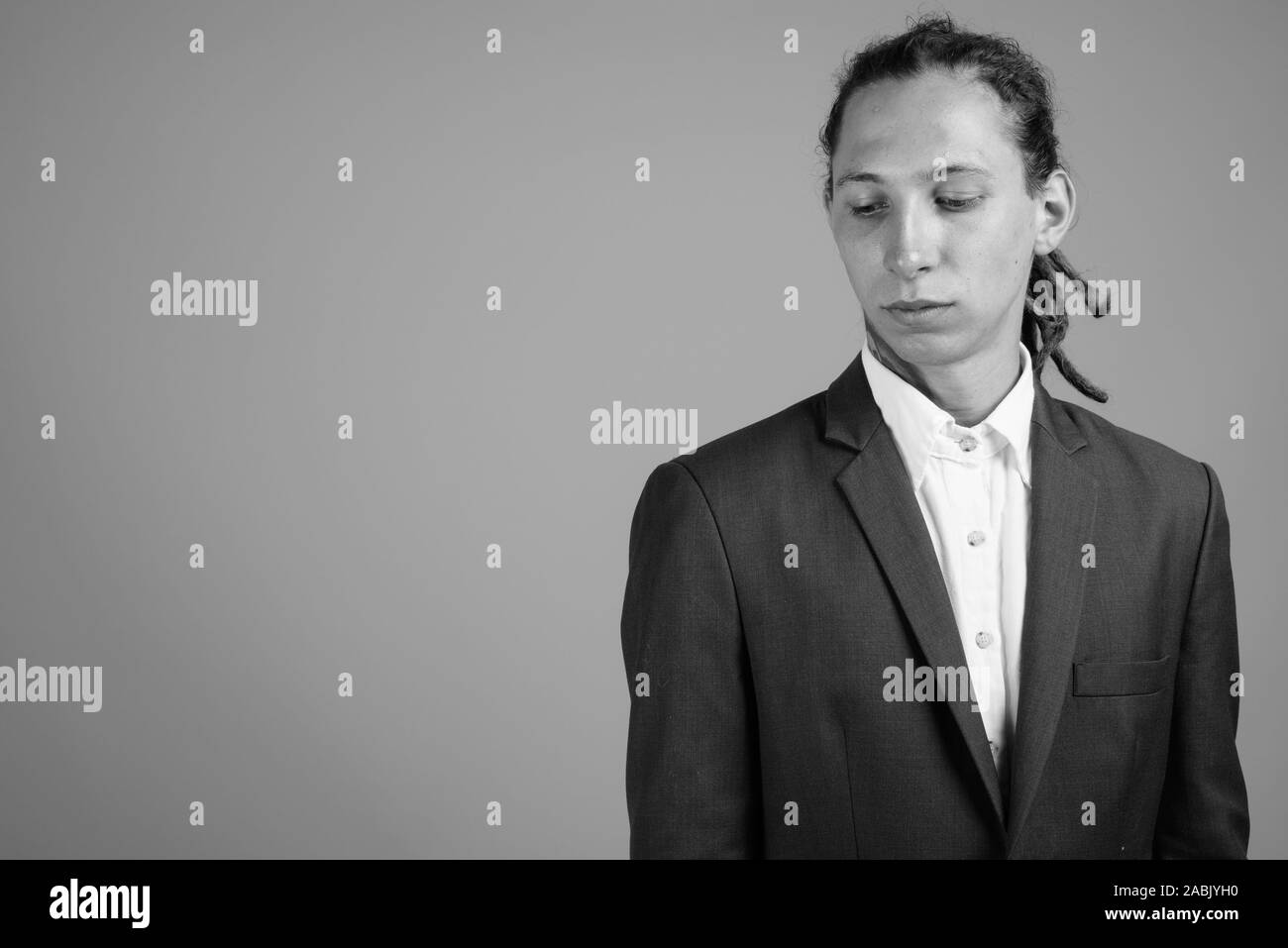 Portrait businessman dreadlocks wearing suit hi-res stock photography ...