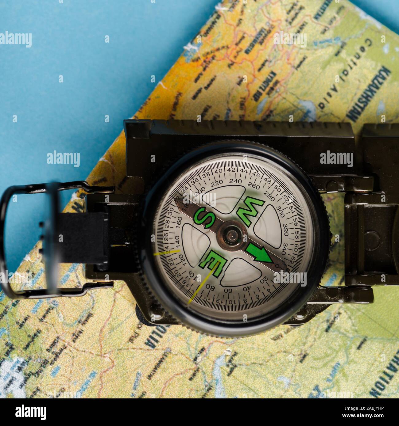 close up of black compass near map on blue Stock Photo - Alamy