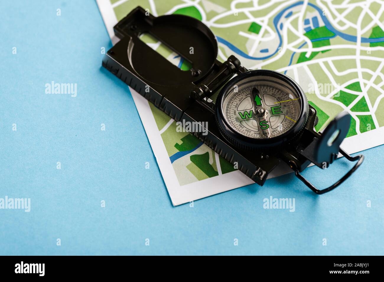 retro and black compass on map on blue Stock Photo - Alamy