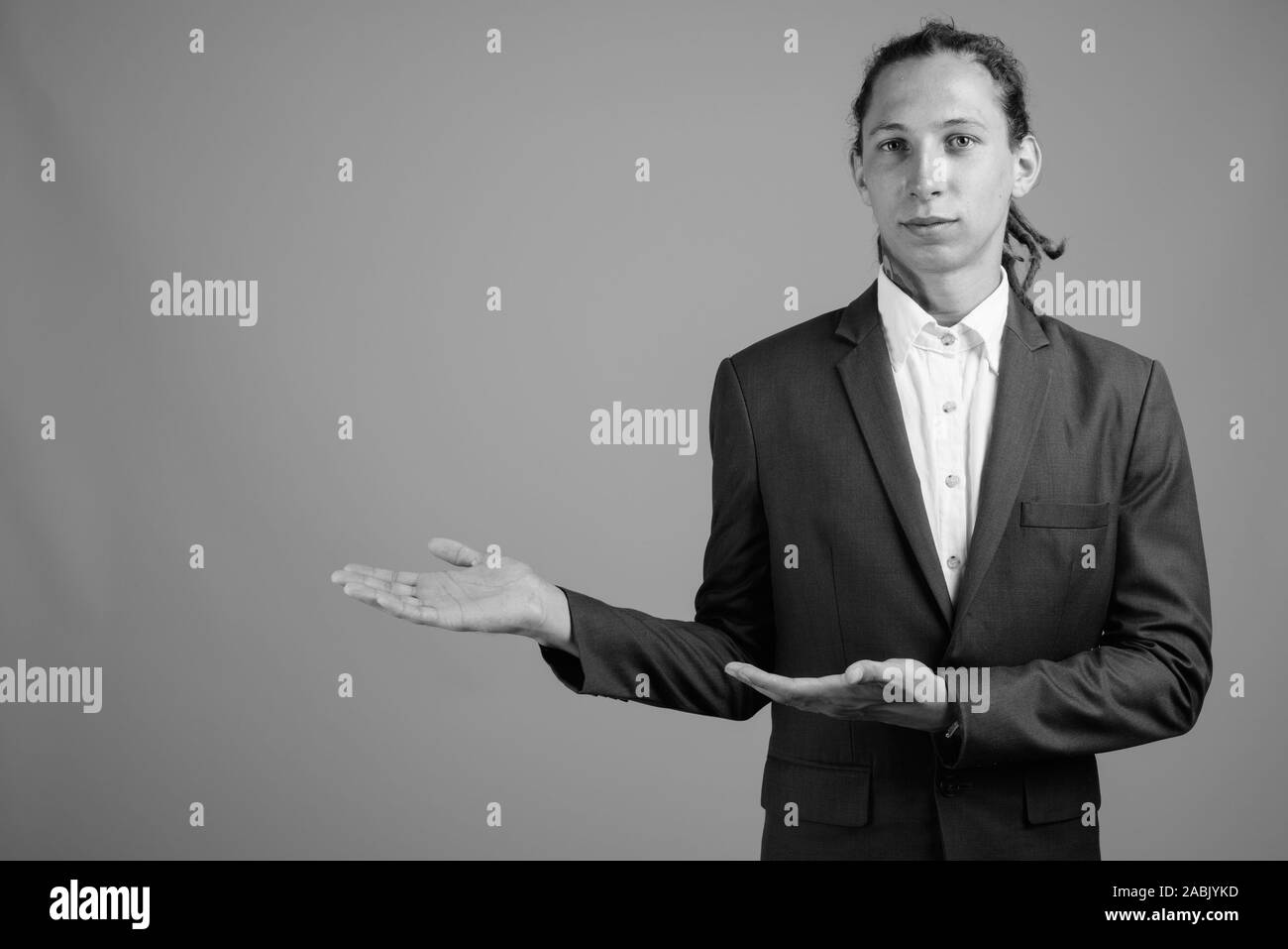 Portrait businessman dreadlocks wearing suit hi-res stock photography ...