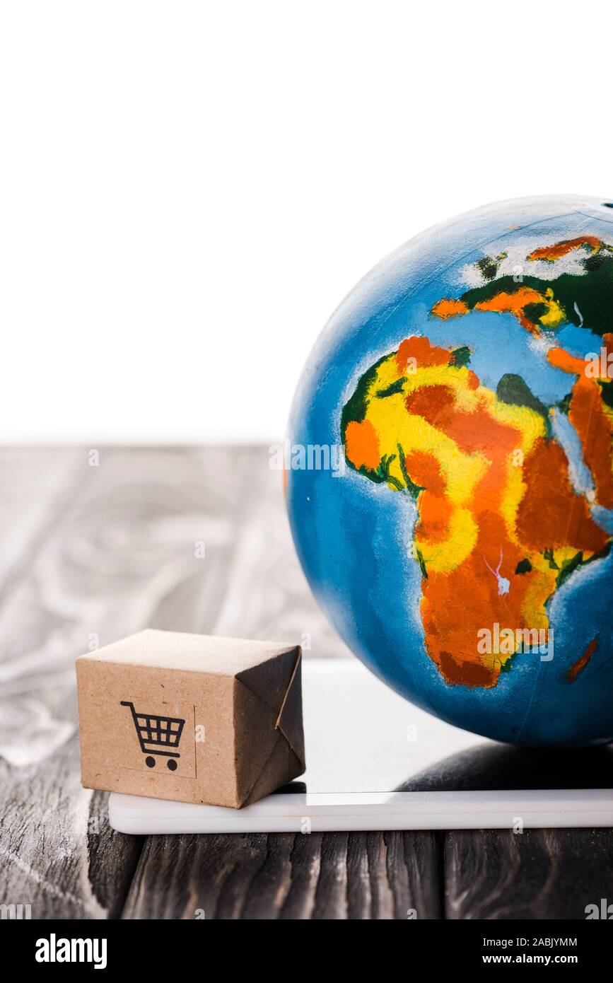 toy box and colorful globe on digital tablet isolated on white, e ...