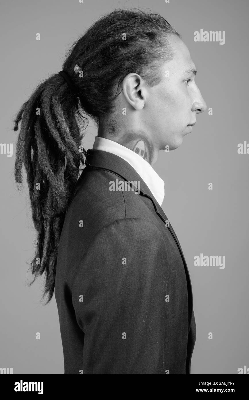 Young businessman with dreadlocks wearing suit in black and white Stock ...