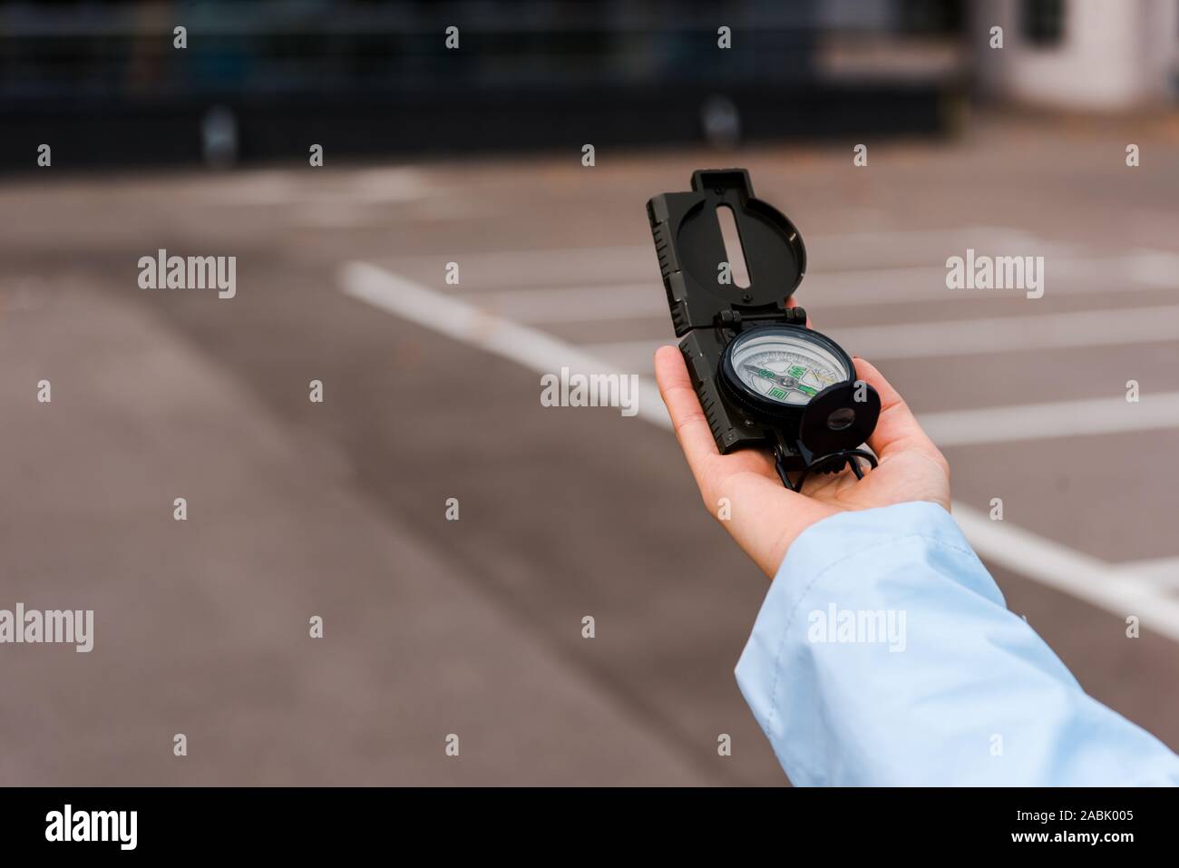 cropped view of woman holding retro compass outside Stock Photo - Alamy
