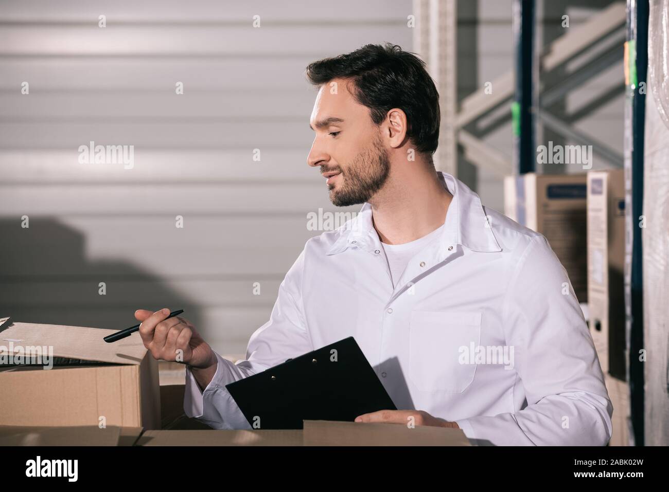 Inspecting boxes hi-res stock photography and images - Alamy