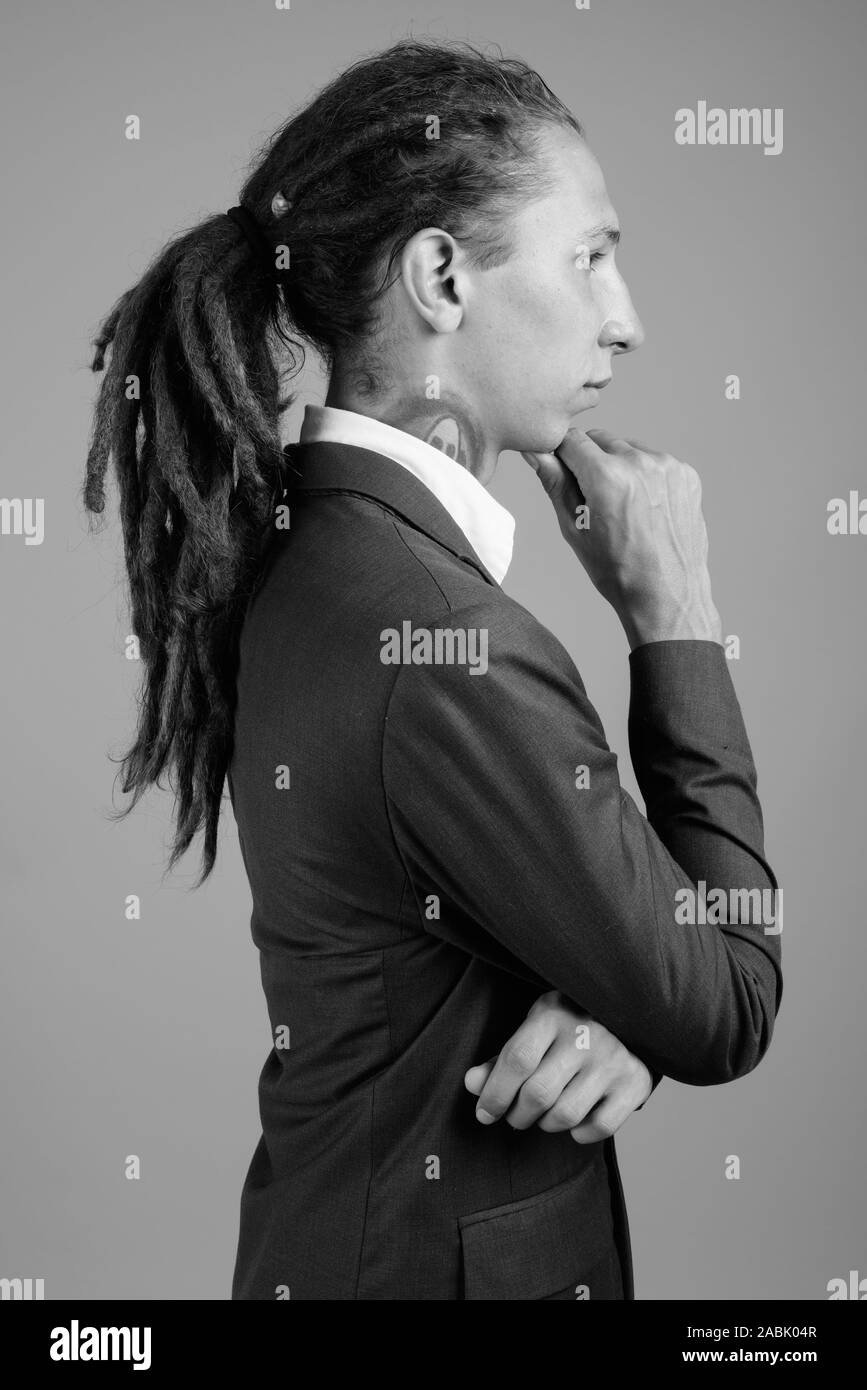 Young businessman with dreadlocks wearing suit in black and white Stock ...