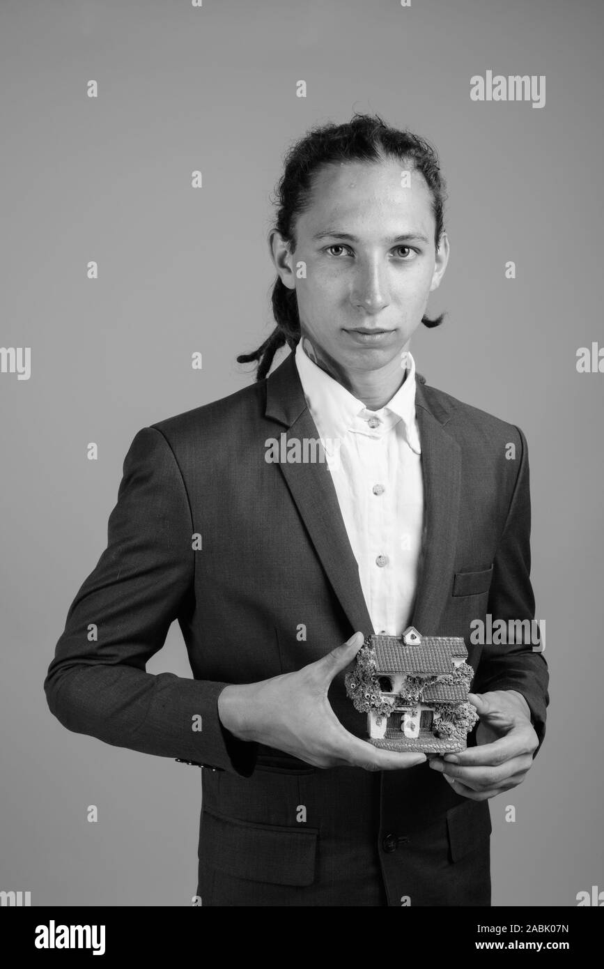 Portrait businessman dreadlocks wearing suit hi-res stock photography ...