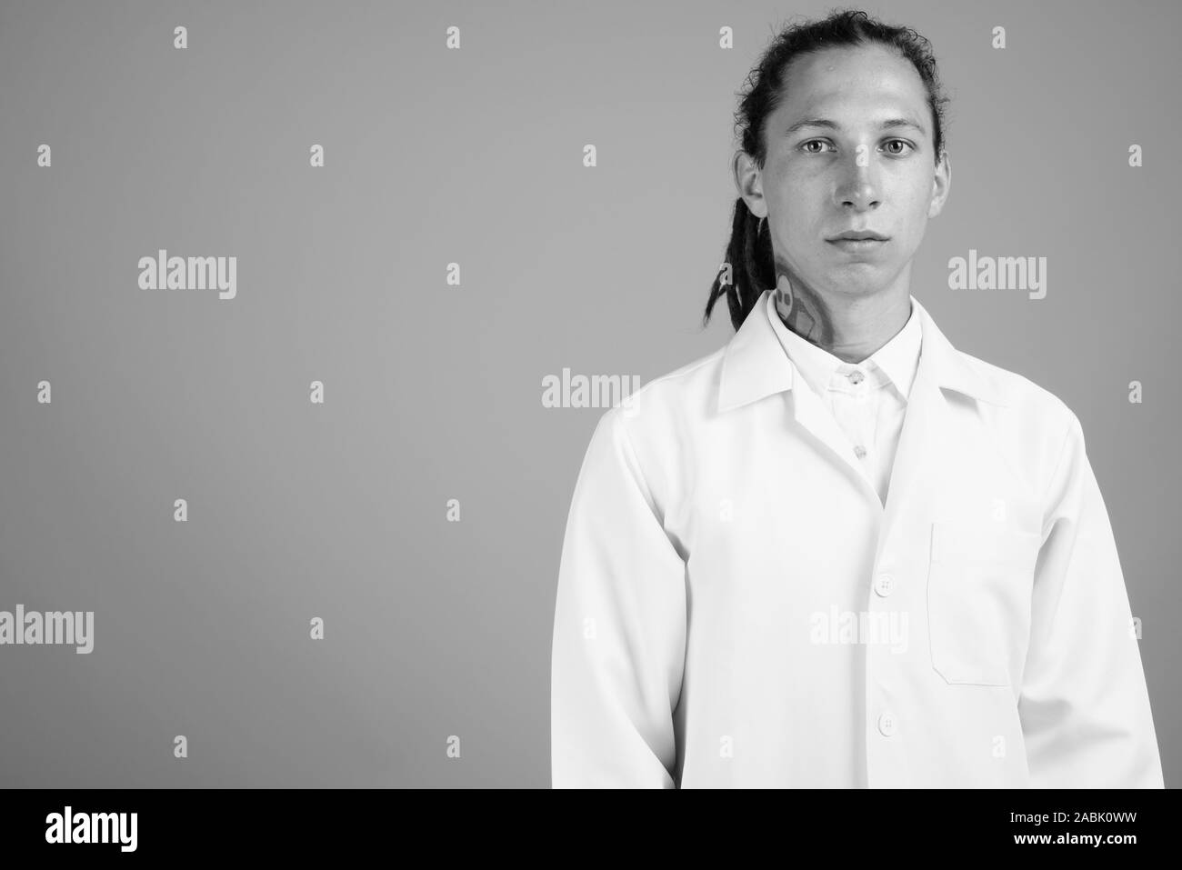 Young man doctor with dreadlocks in black and white Stock Photo - Alamy