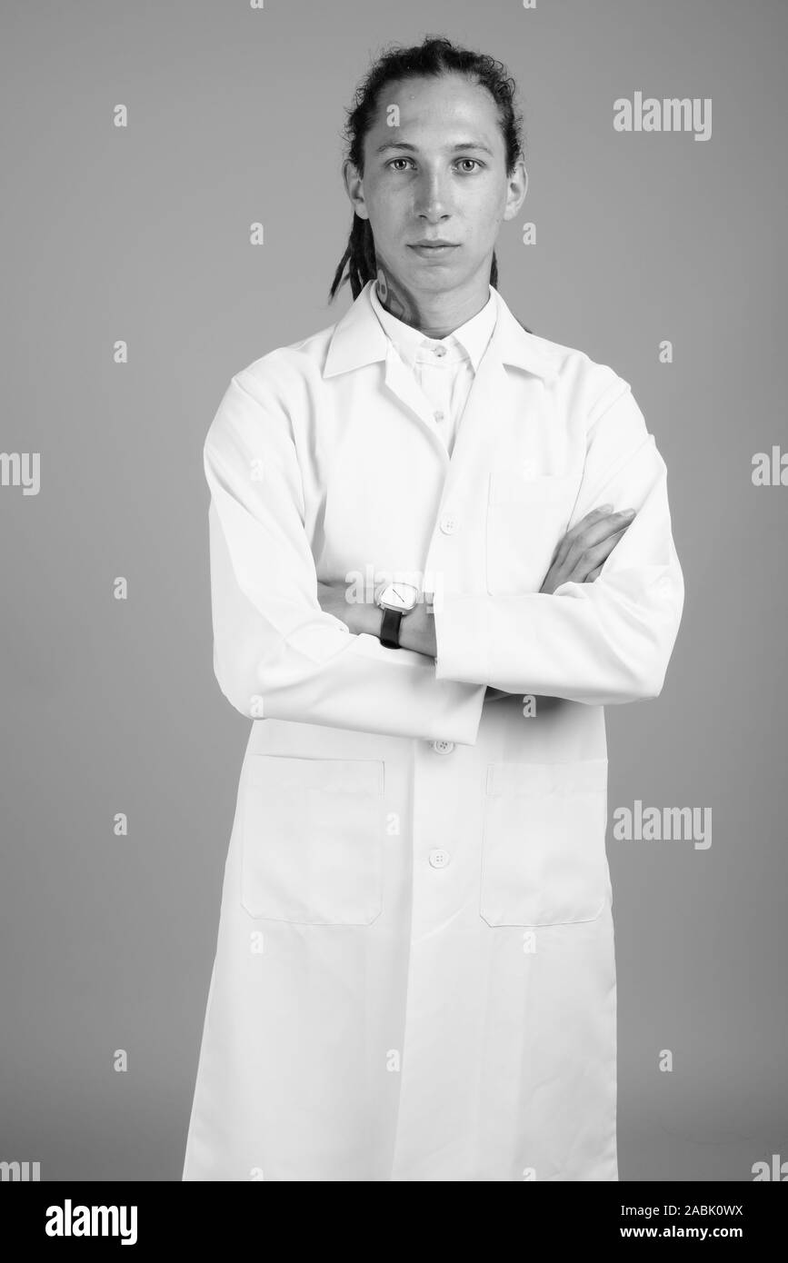 Young man doctor with dreadlocks in black and white Stock Photo - Alamy
