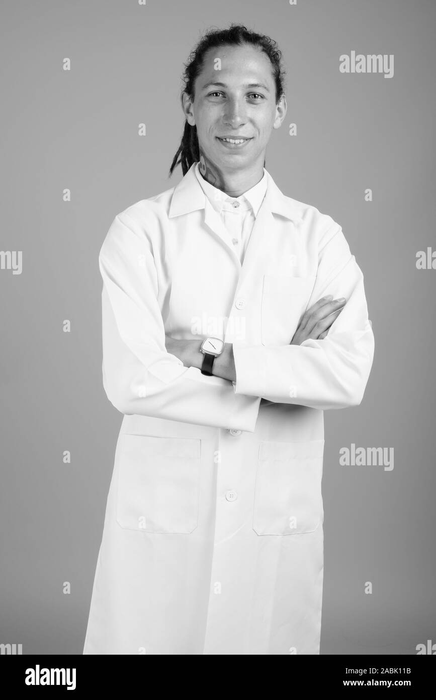 Young man doctor with dreadlocks in black and white Stock Photo - Alamy