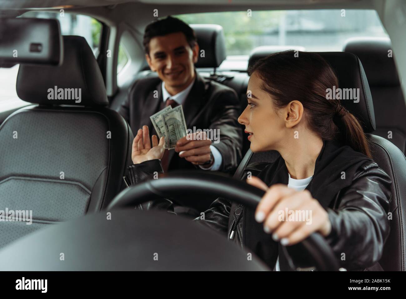 Man paying taxi driver hi-res stock photography and images - Alamy