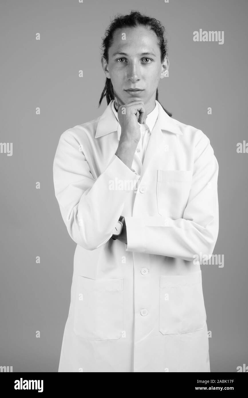 Young man doctor with dreadlocks in black and white Stock Photo - Alamy