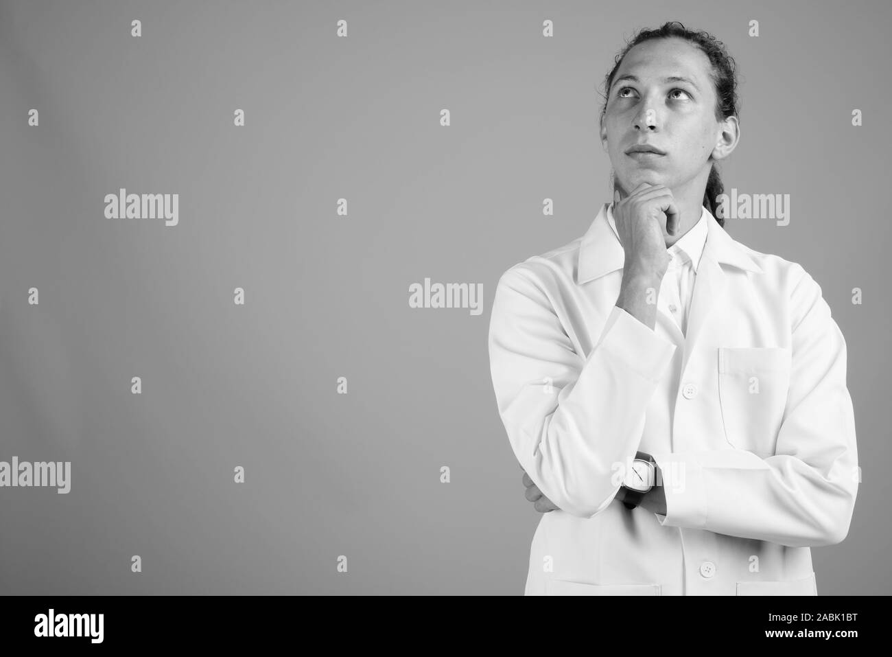 Young man doctor with dreadlocks in black and white Stock Photo - Alamy