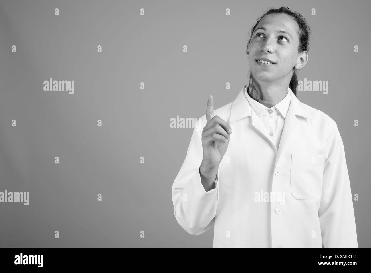 Young man doctor with dreadlocks in black and white Stock Photo - Alamy