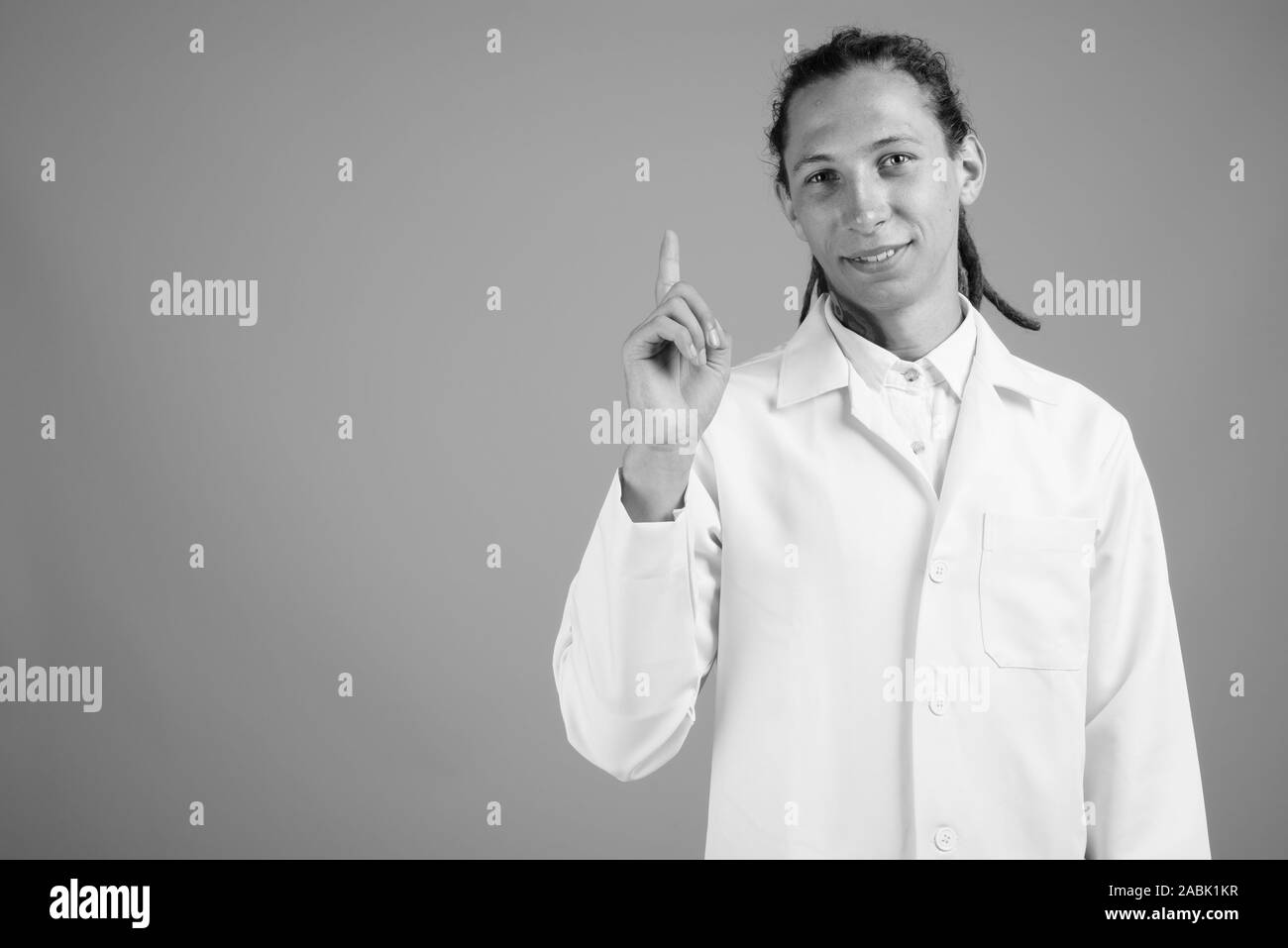 Young man doctor with dreadlocks in black and white Stock Photo - Alamy