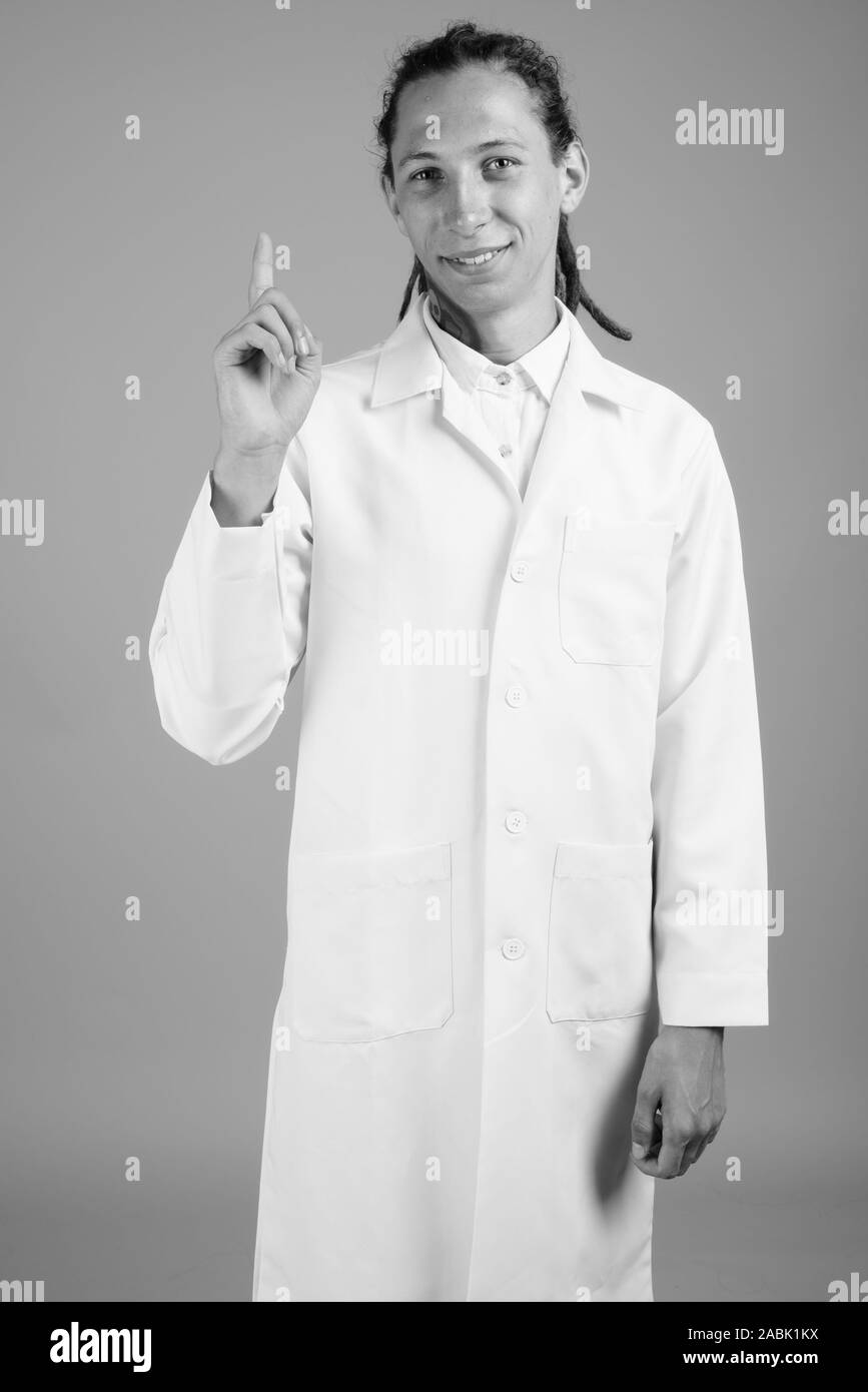 Young man doctor with dreadlocks in black and white Stock Photo - Alamy