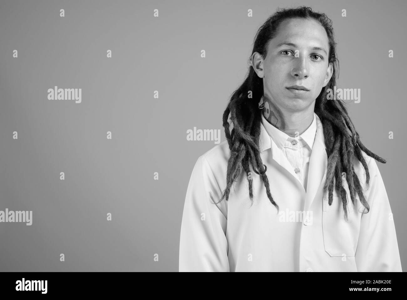 Young man doctor with dreadlocks in black and white Stock Photo - Alamy
