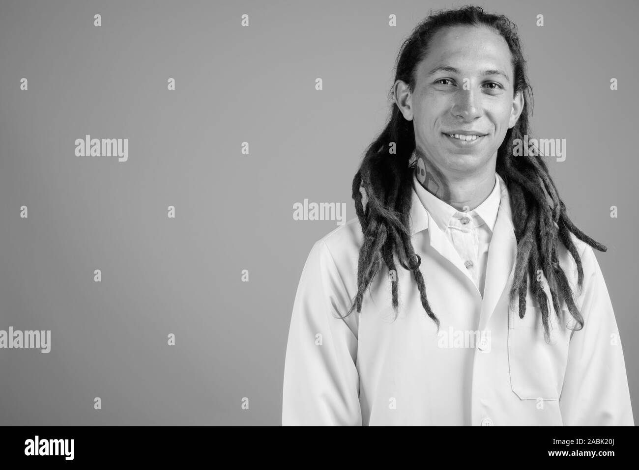 Young man doctor with dreadlocks in black and white Stock Photo - Alamy