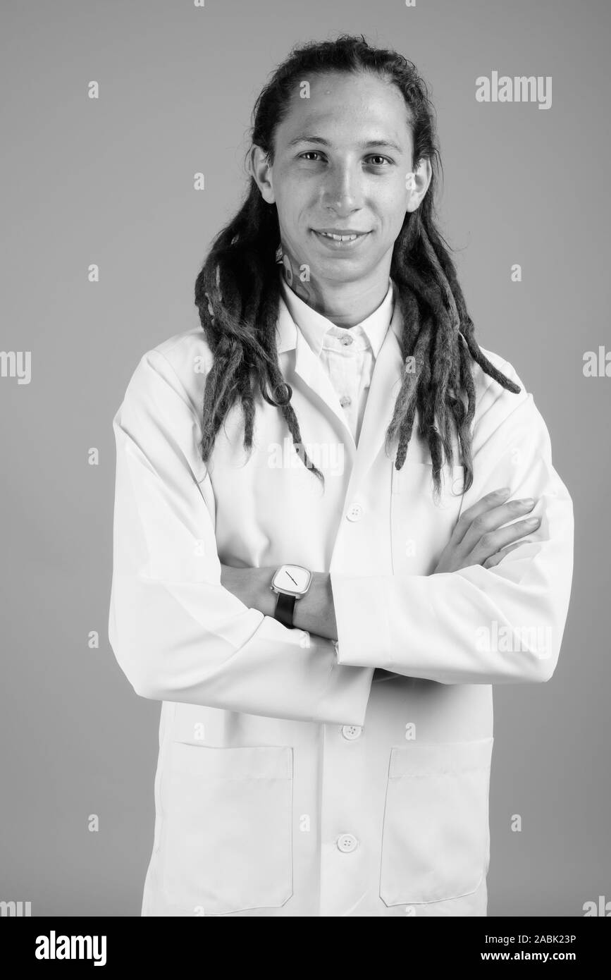 Young man doctor with dreadlocks in black and white Stock Photo - Alamy