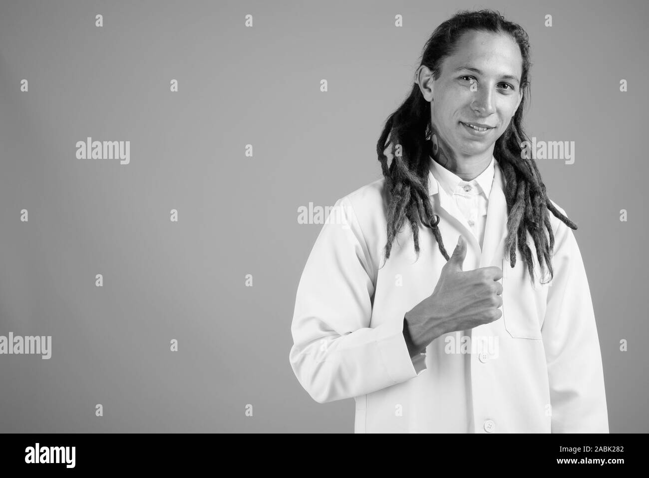 Young man doctor with dreadlocks in black and white Stock Photo - Alamy