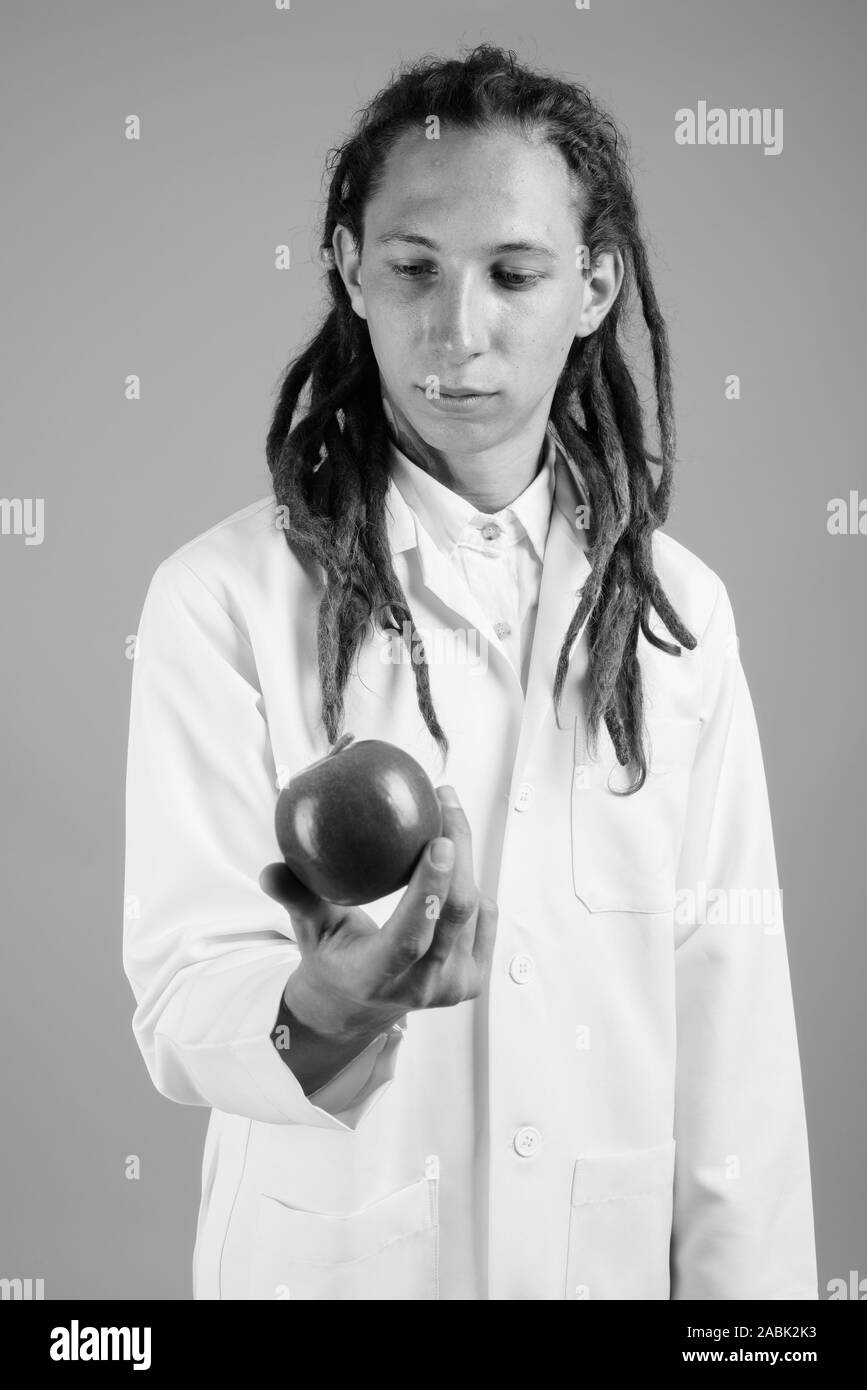 Young man doctor with dreadlocks in black and white Stock Photo - Alamy