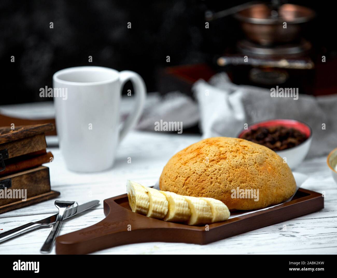 white bread on desk with side sliced banana Stock Photo - Alamy