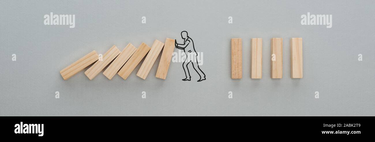 panoramic shot of drawn man pushing wooden blocks on grey background ...