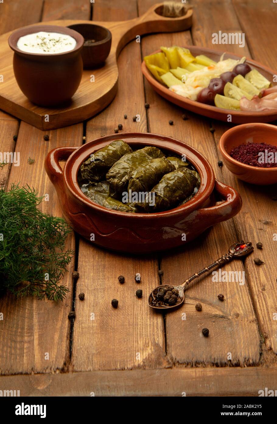 leaves dolma in pot with side pickles Stock Photo - Alamy
