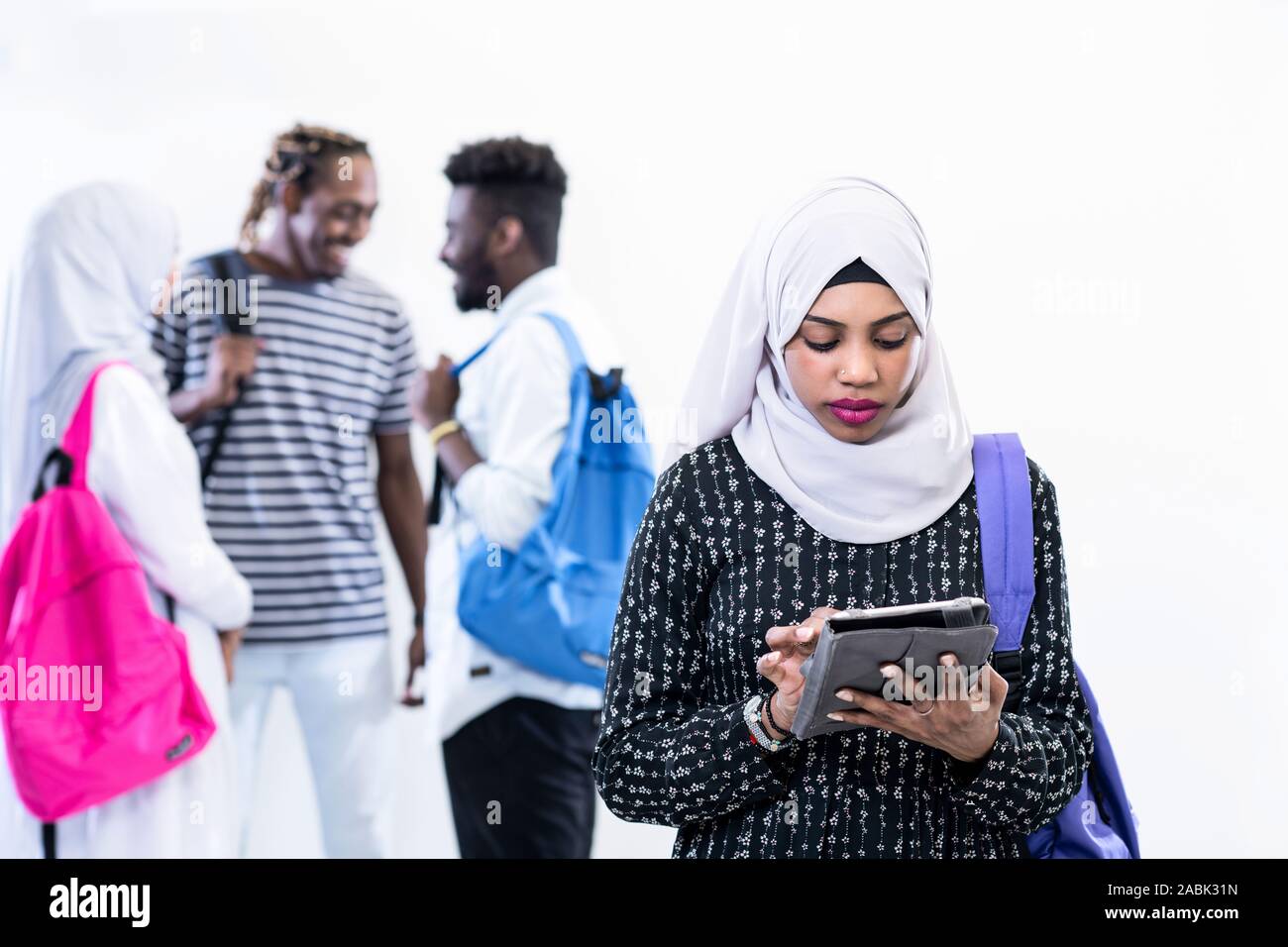 young african modern muslim female student using tablet computer with ...