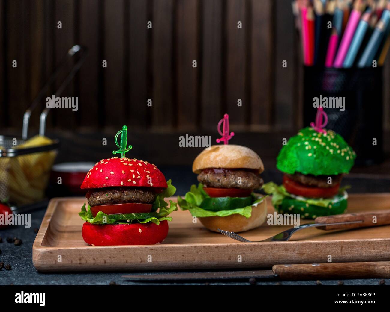 mini burgers with coloured buns Stock Photo - Alamy