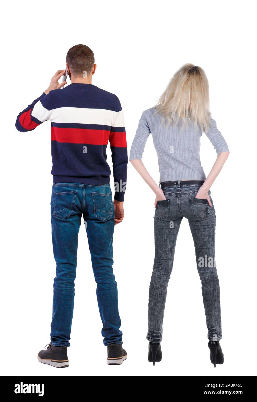 Back view of couple. beautiful friendly girl and guy together. Rear ...