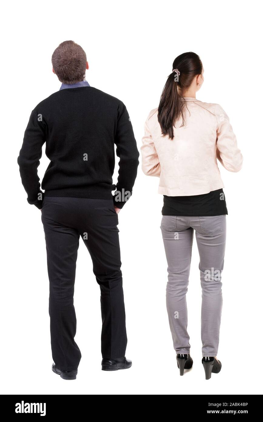 Back view of couple. beautiful friendly girl and guy together. Rear ...